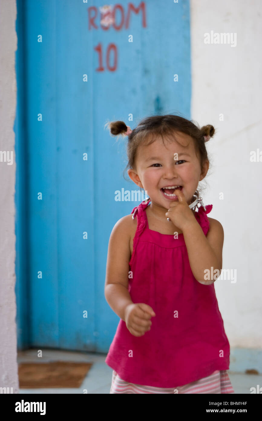 cheeky little girl in pink Stock Photo - Alamy