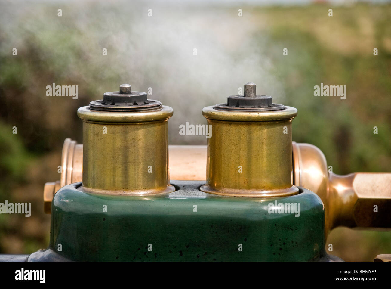 Bras parts on a steam engine with steam coming from them Stock Photo ...