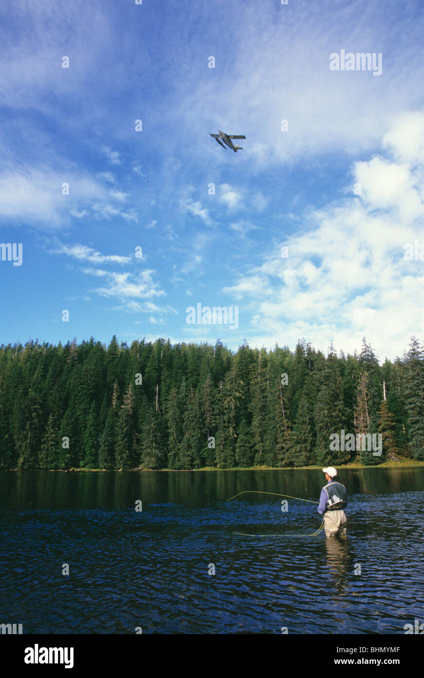 Man fly fishing Stock Photo - Alamy