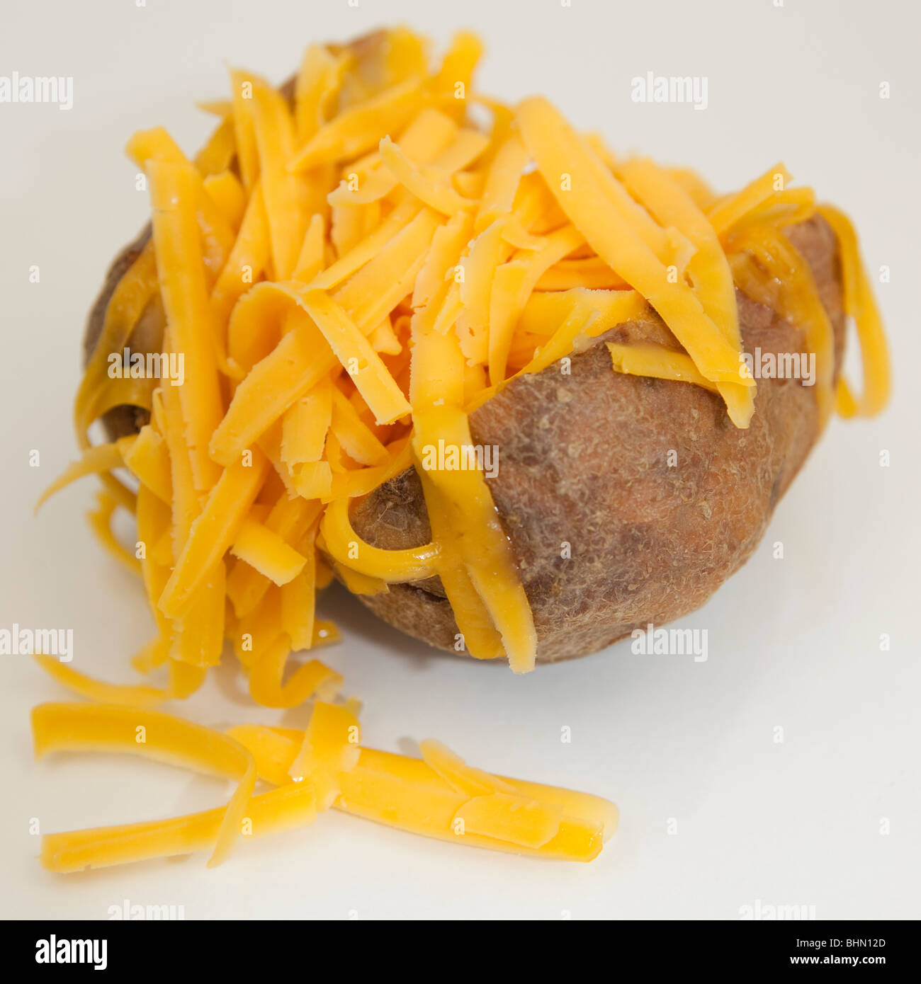 Jacket Potato with Grated Cheese Stock Photo - Alamy