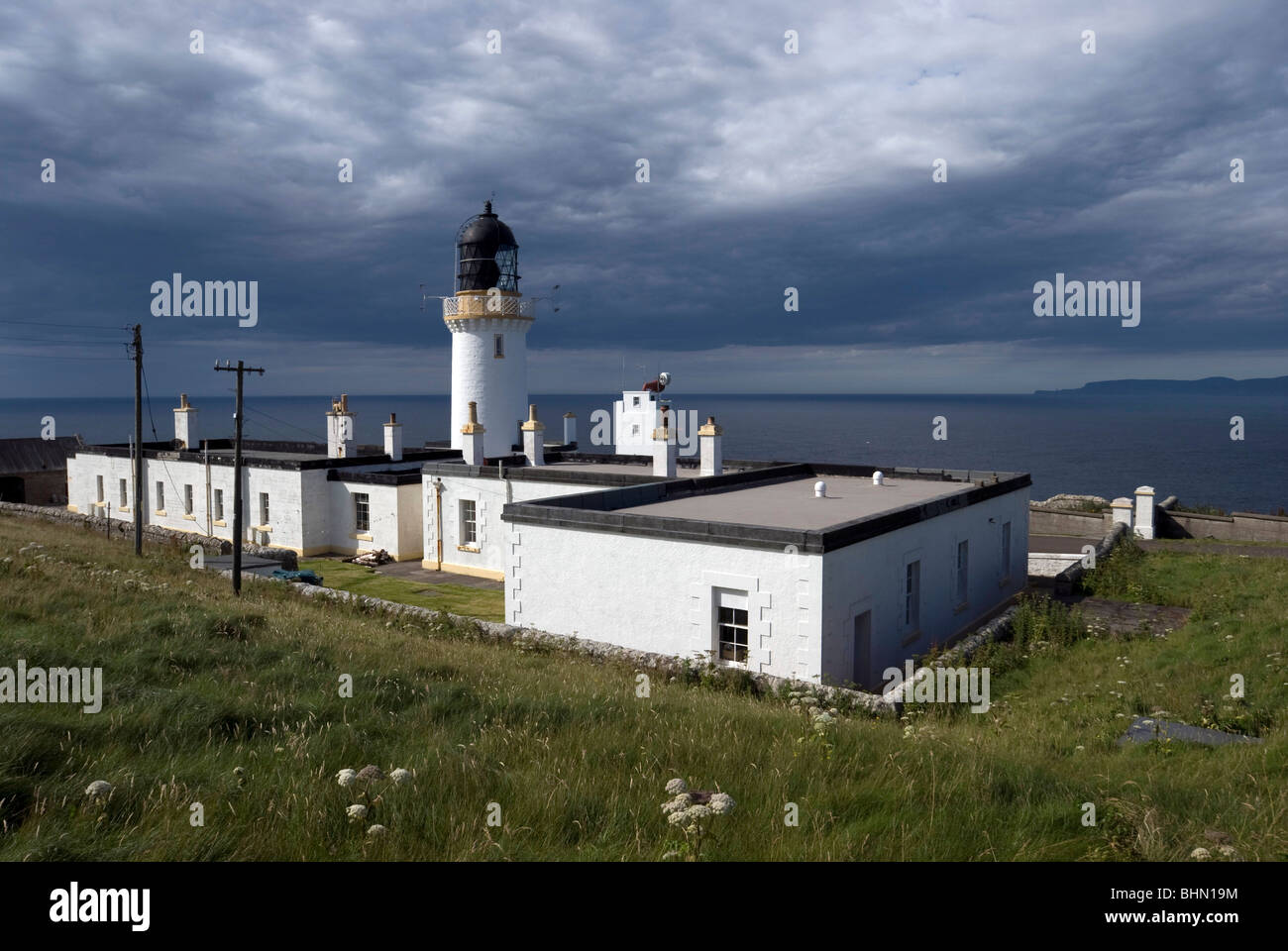 The lighthouse at Dunnet Head on the north coast of Scotland with the ...