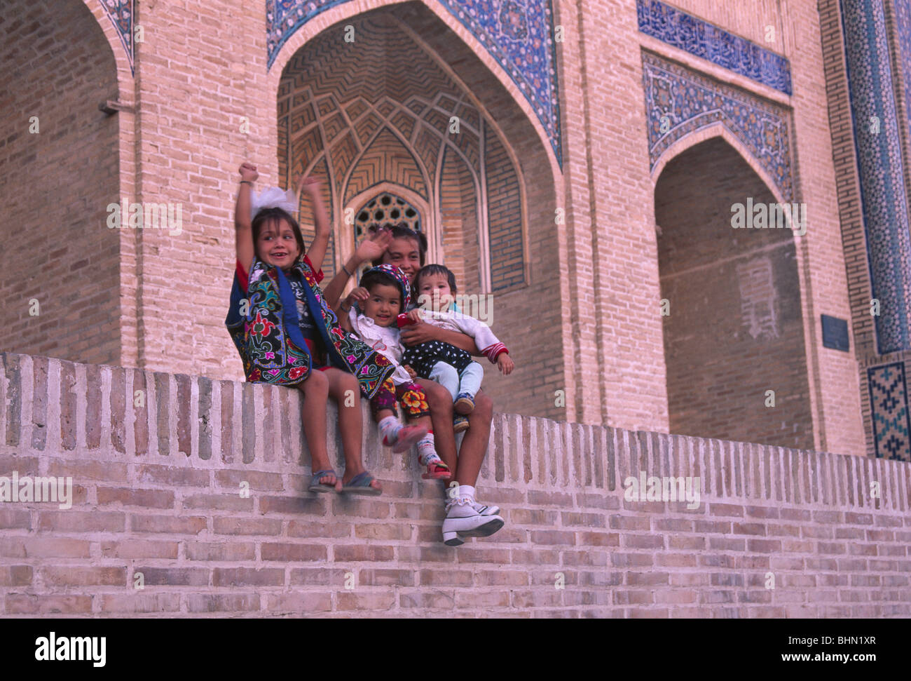 Uzbek children in front of Mir-i-Arab Medressa, Bukhara, Uzbekistan ...