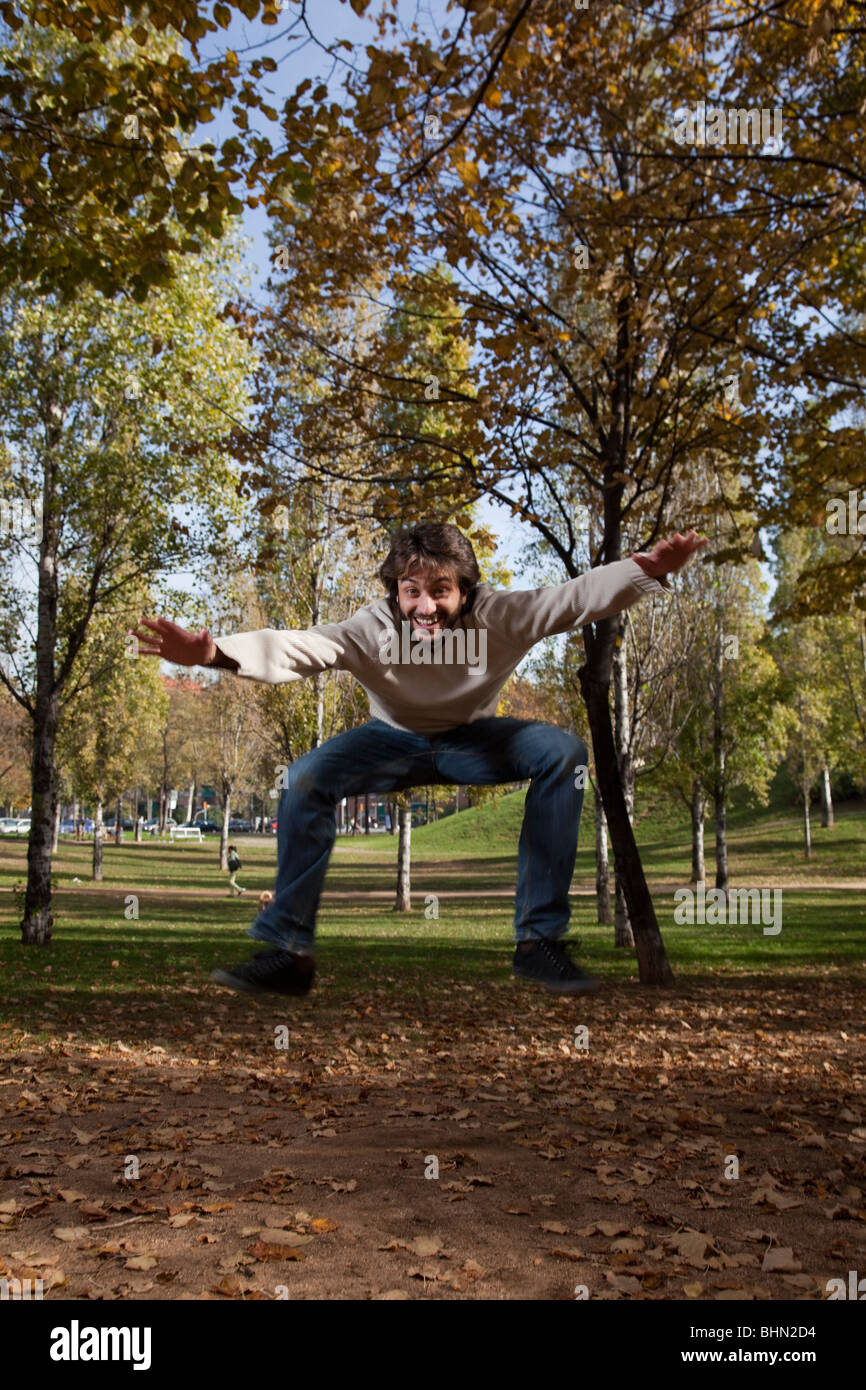 A young Man jumping in a park Stock Photo - Alamy