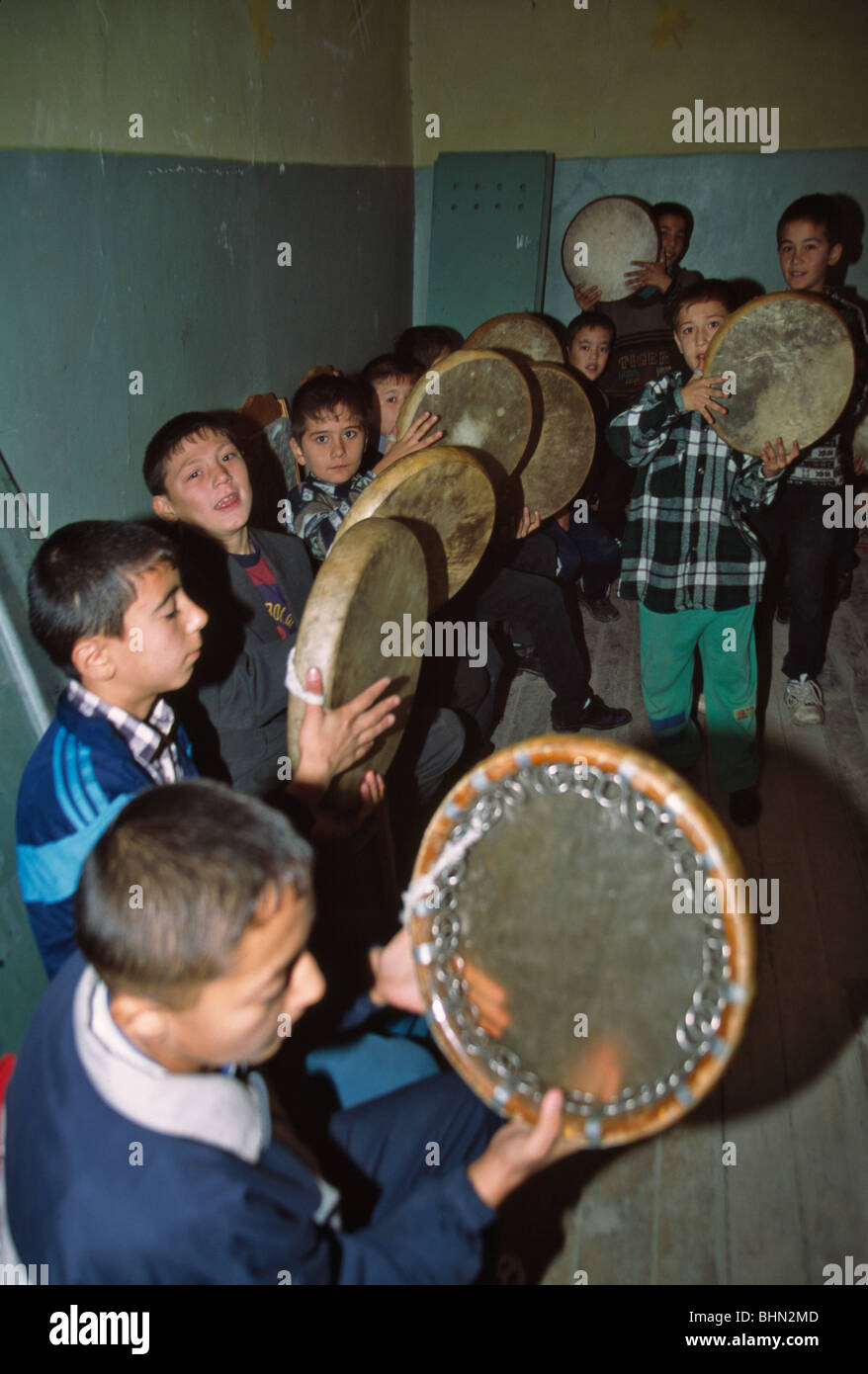 Uzbek children playing hand drum, Khiva, Uzbekistan Stock Photo - Alamy