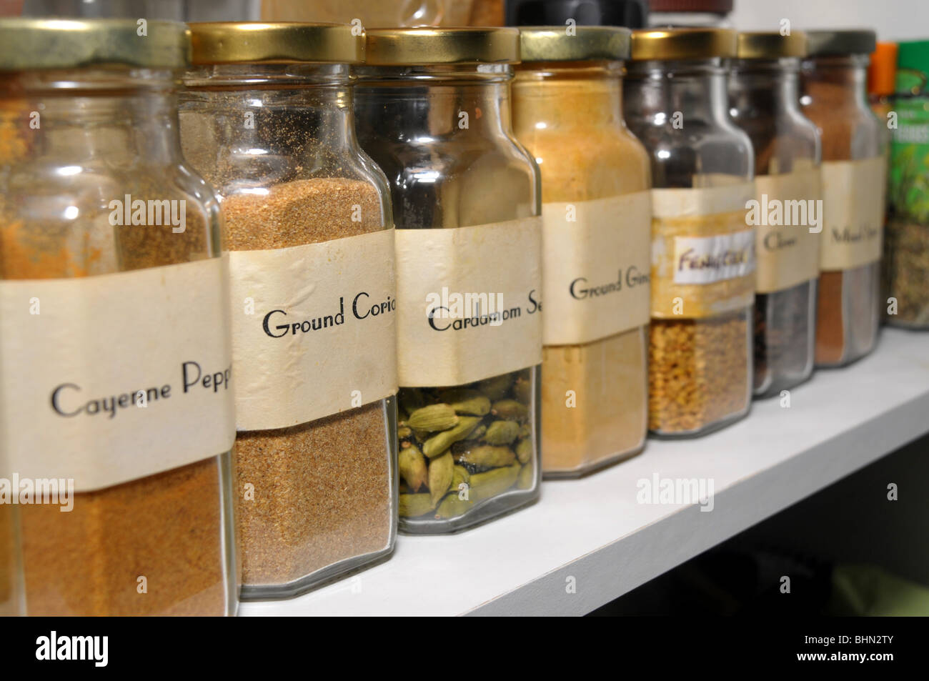 A kitchen cupboard shelf full of bottled spices Stock Photo - Alamy