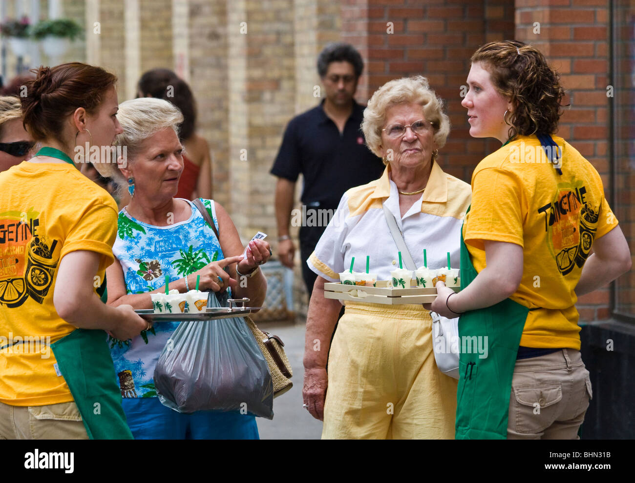 Girls giving out Starbucks beverage samples in the street, Toronto ...