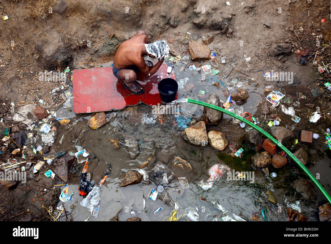 Local man conducts his morning ablutions at Yamuna River Delhi.Every ...