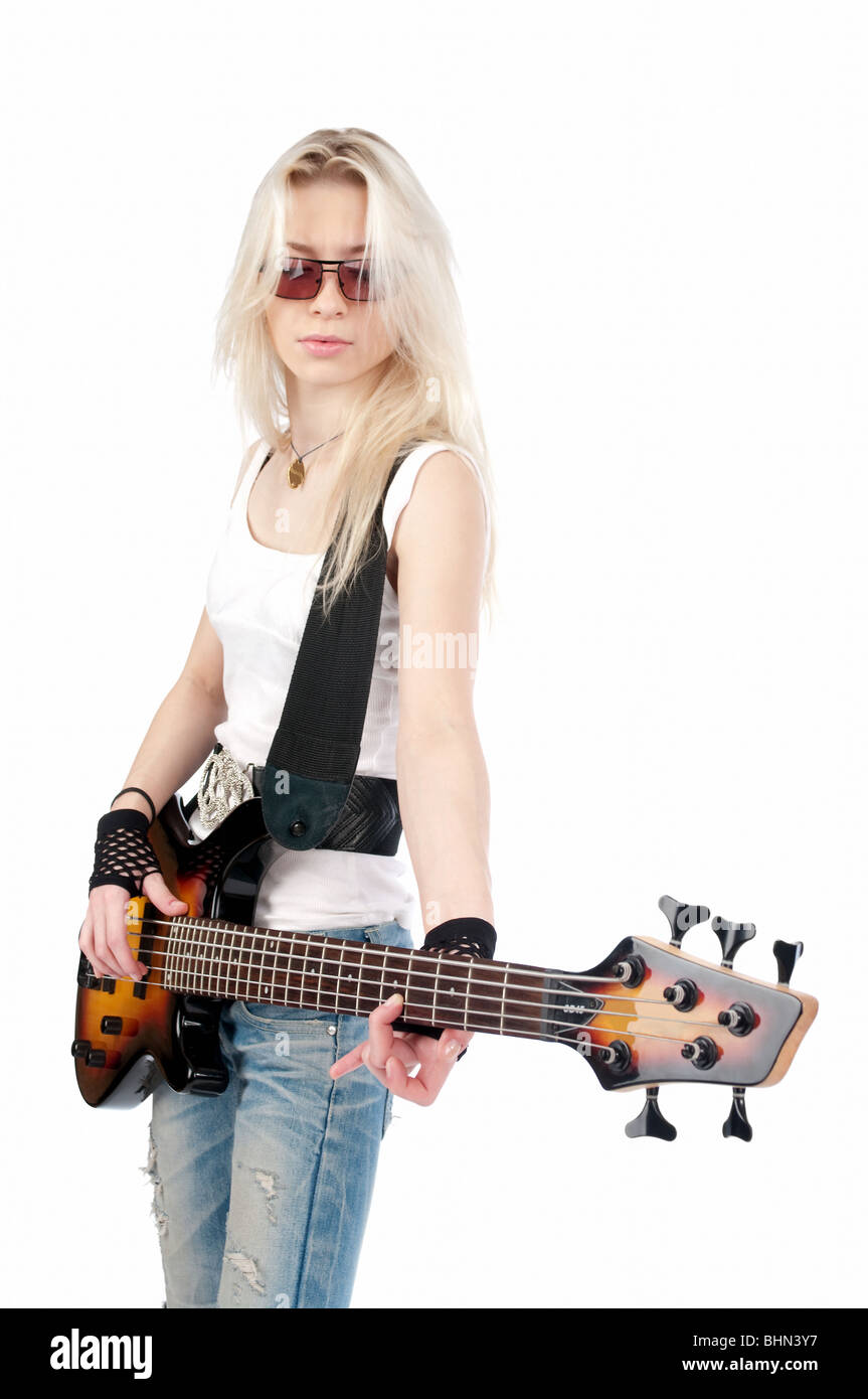 Young blond woman playing on the electric bass guitar, isolated on the ...