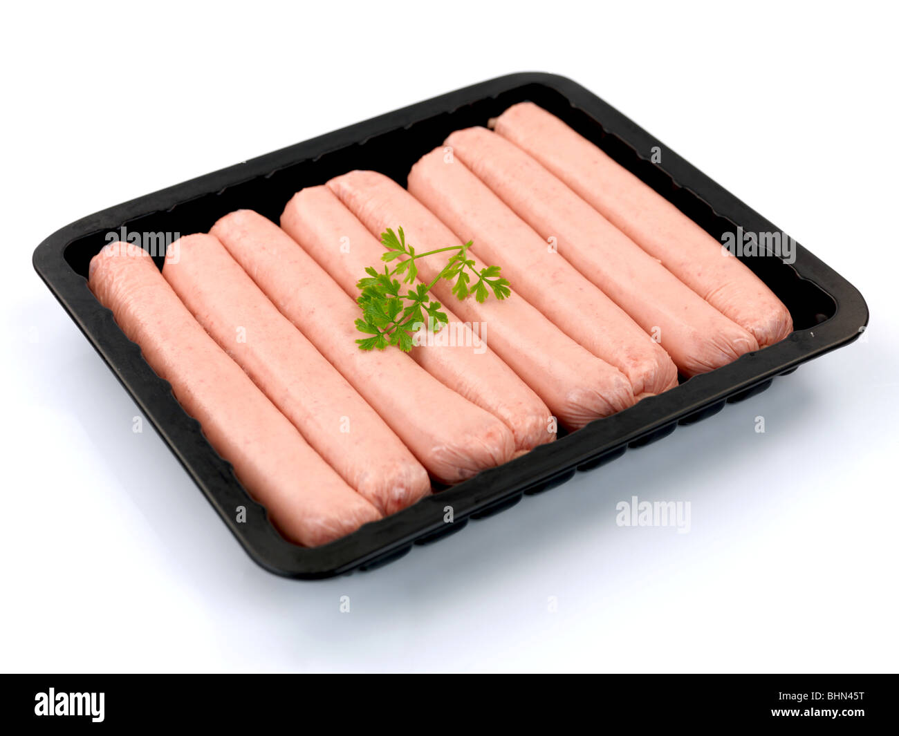 Supermarket packaged pork sausages isolated against a white background ...