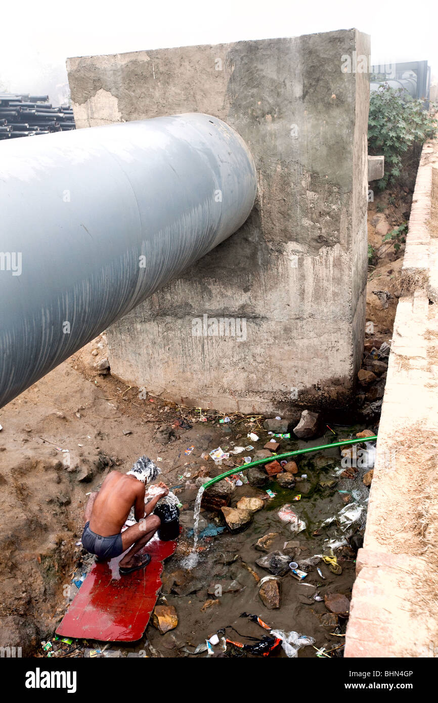 Local man conducts his morning ablutions at Yamuna River Delhi.Every ...