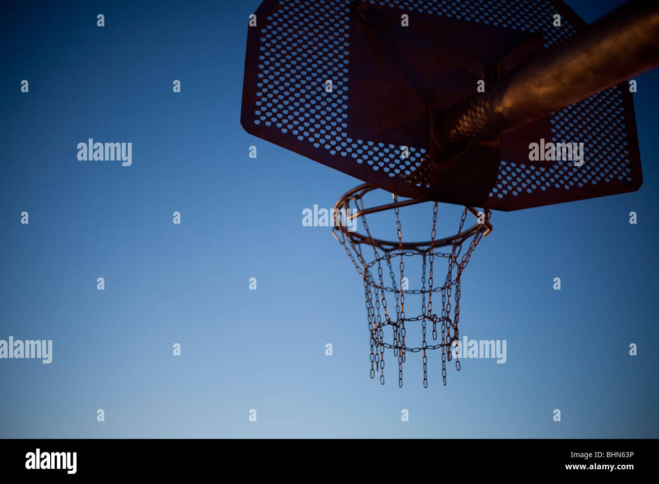 Metal basketball hoop on a street during a sunset Stock Photo - Alamy