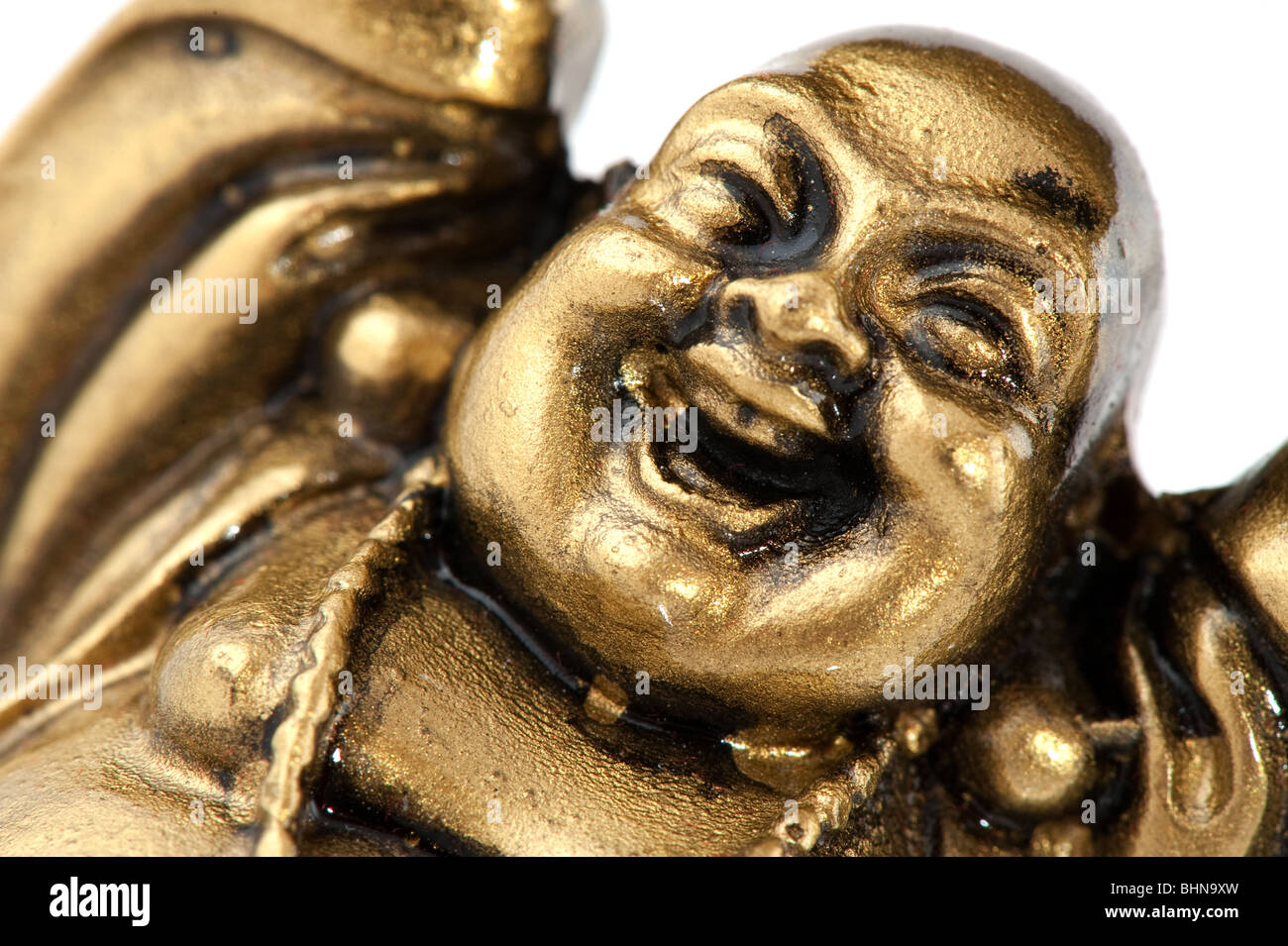 Funny laughing golden Buddha on white background Stock Photo - Alamy