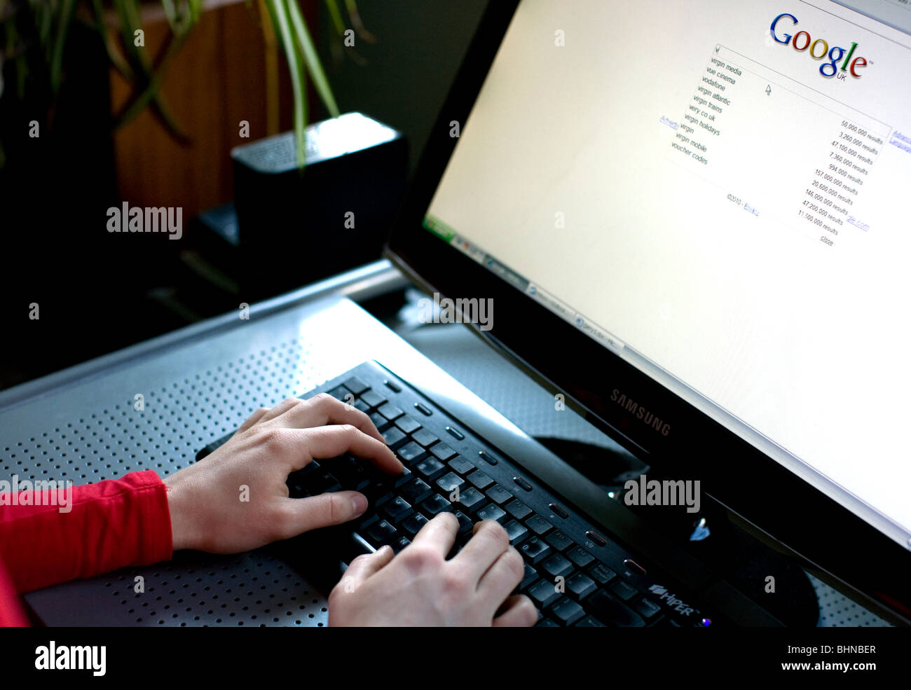 Young person using Google on computer, London - Model Released Stock ...