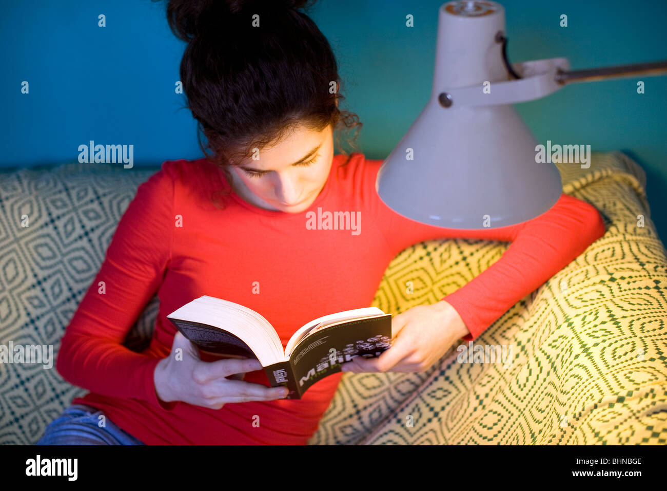 Young woman reading book, London - Model Released Stock Photo - Alamy