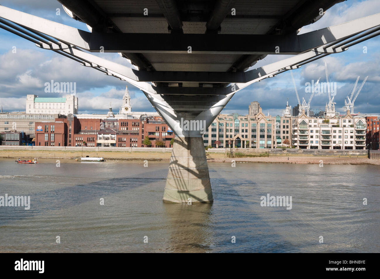 View under the Millennium Bridge, south bank of the Thames River ...