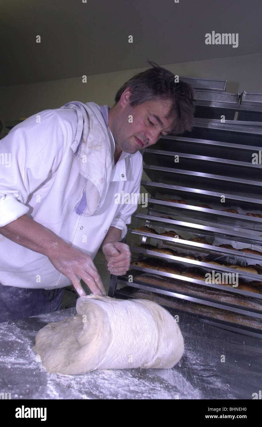 Baker prepares loaf bread bakery hi-res stock photography and images ...
