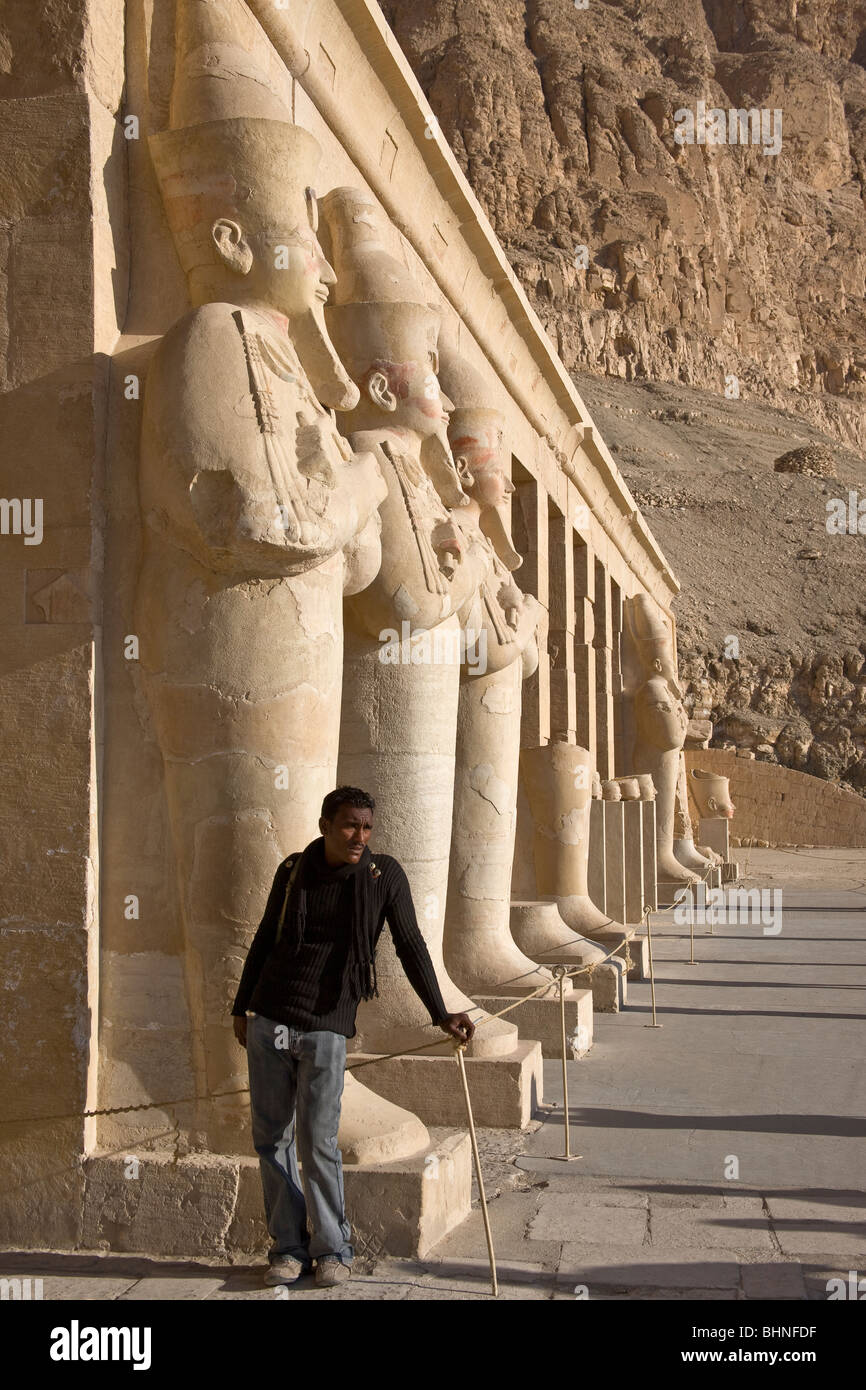 Statues of Queen Hatshepsut, while temple guard watches the crowd Stock ...