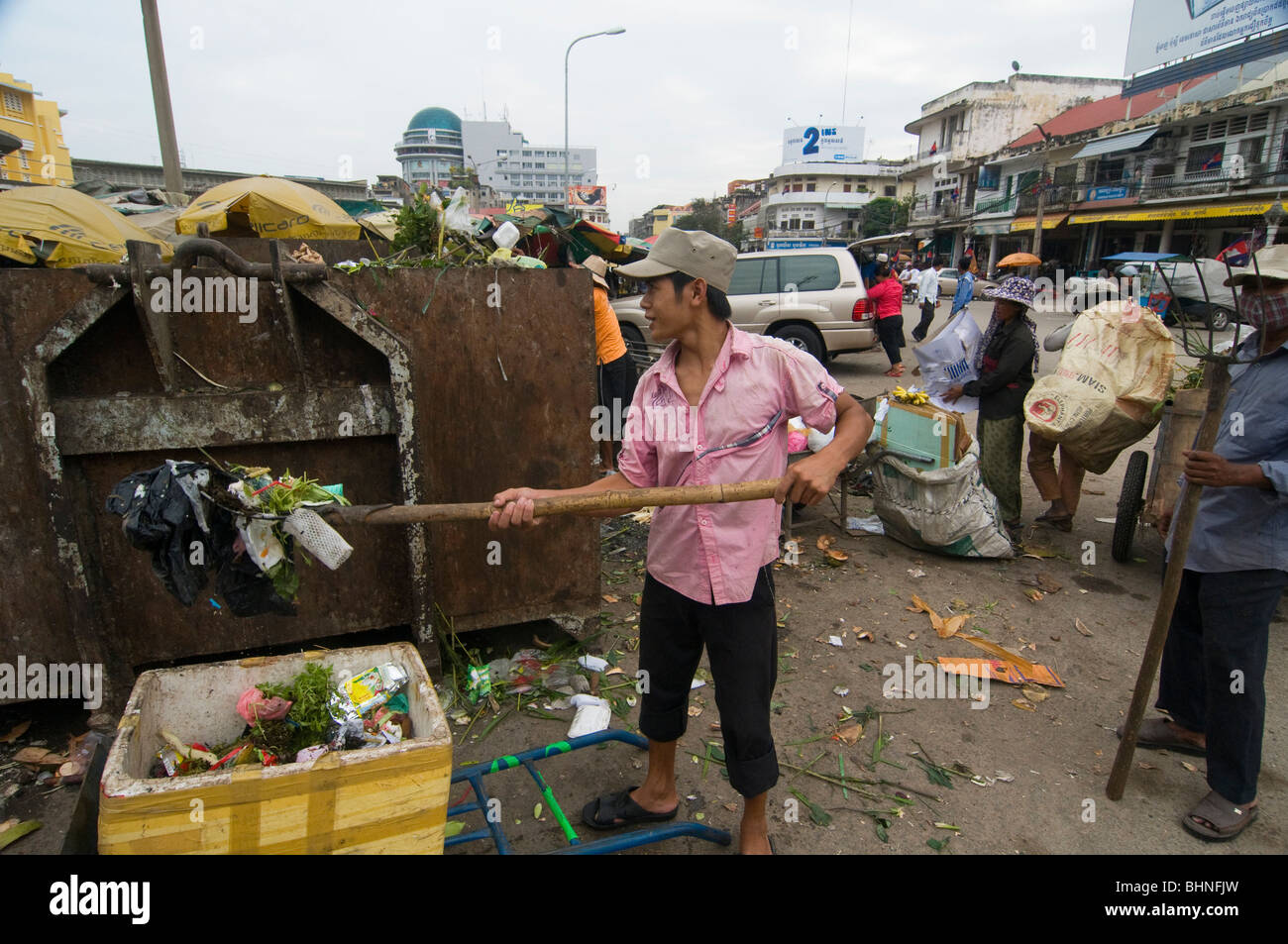 street worker removing garbage in Phnom Penh Cambodia Stock Photo - Alamy