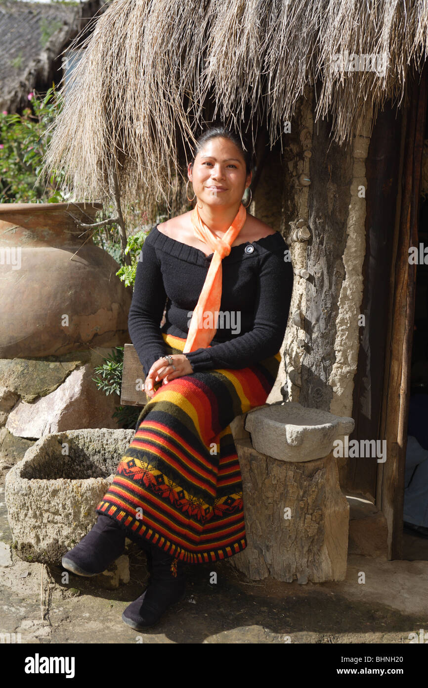 Quechua woman in traditional dress at village by Mitad del Mundo museum ...