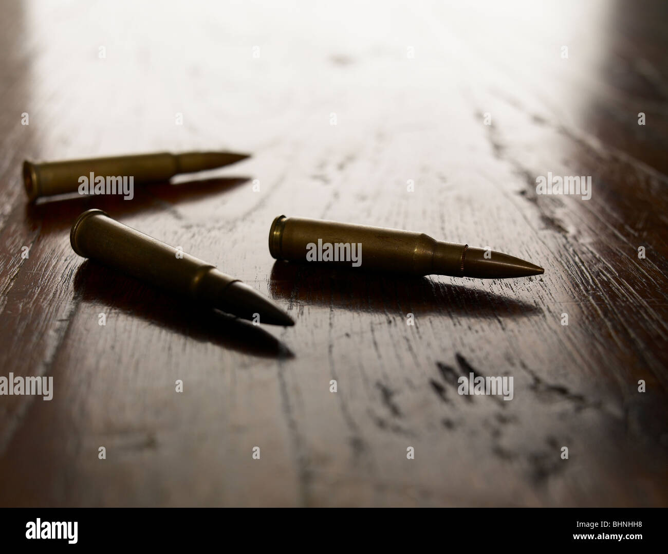 bullets on a table top Stock Photo - Alamy