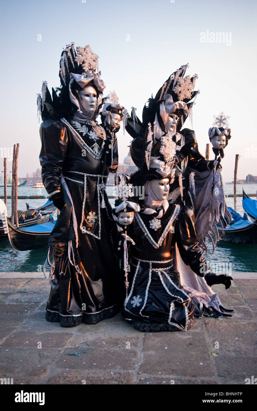 Carnival goers pose alongside the canals of Venice Stock Photo - Alamy