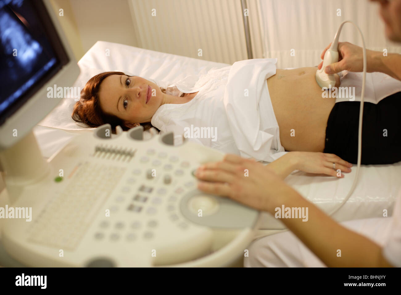 pregnant woman getting an ultrasound checkup Stock Photo - Alamy