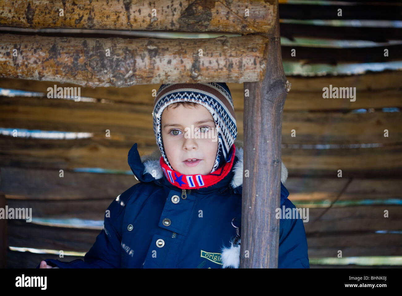 Cute 7 year old kid playing in a small wooden house Stock Photo - Alamy