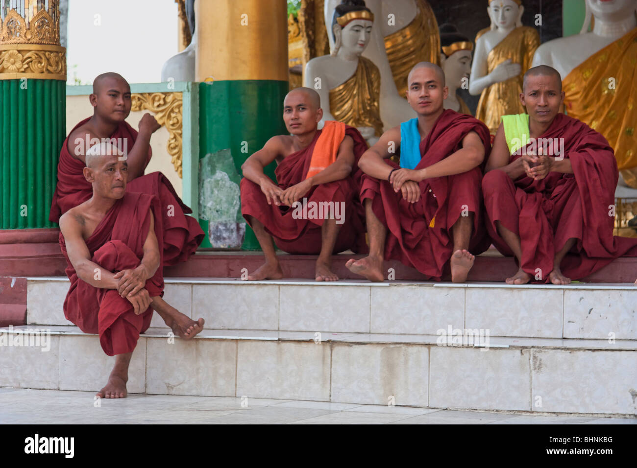 Resting monks in Yangon in Myanmar Stock Photo - Alamy