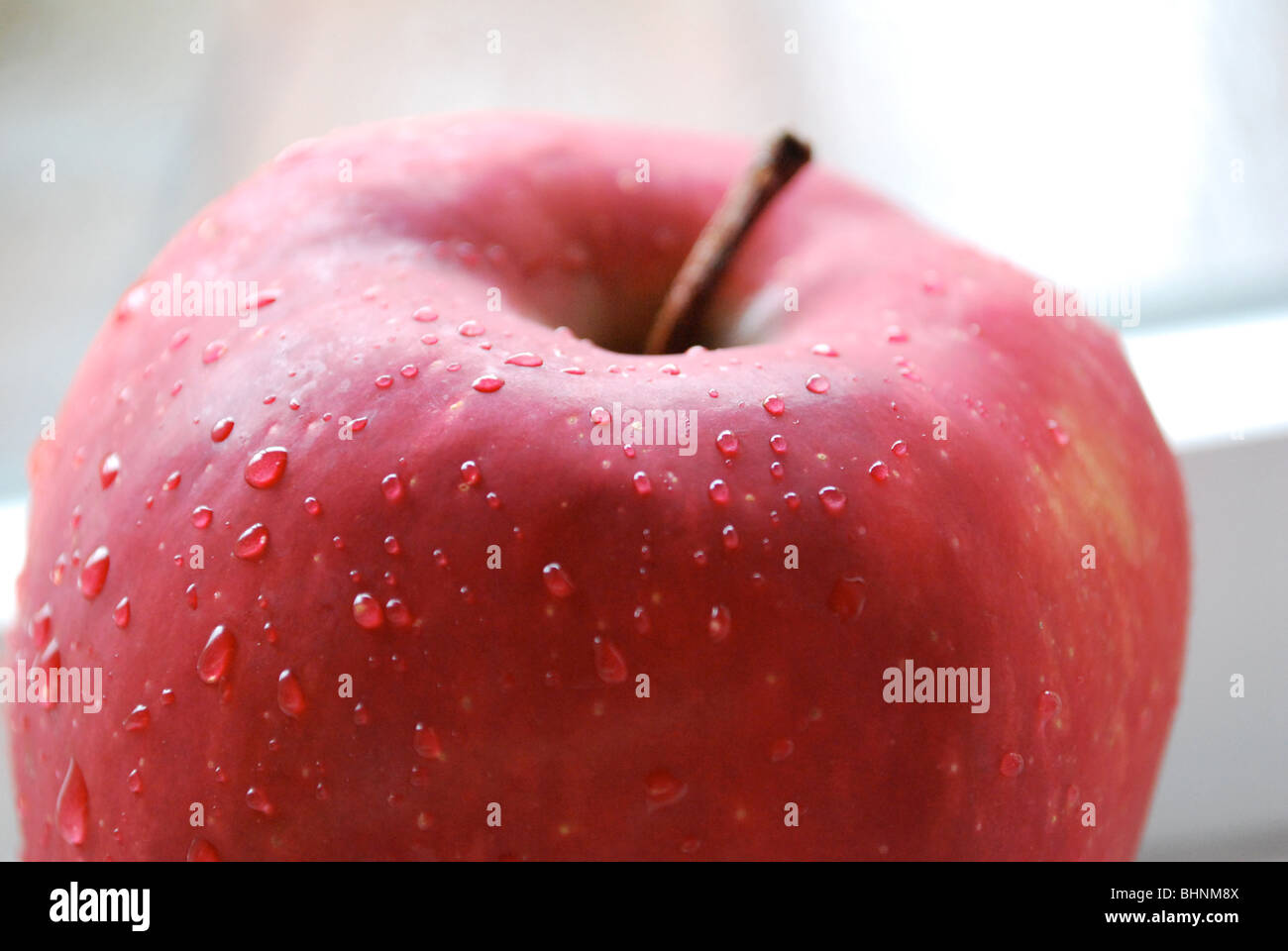 Red apple with water droplets Stock Photo - Alamy