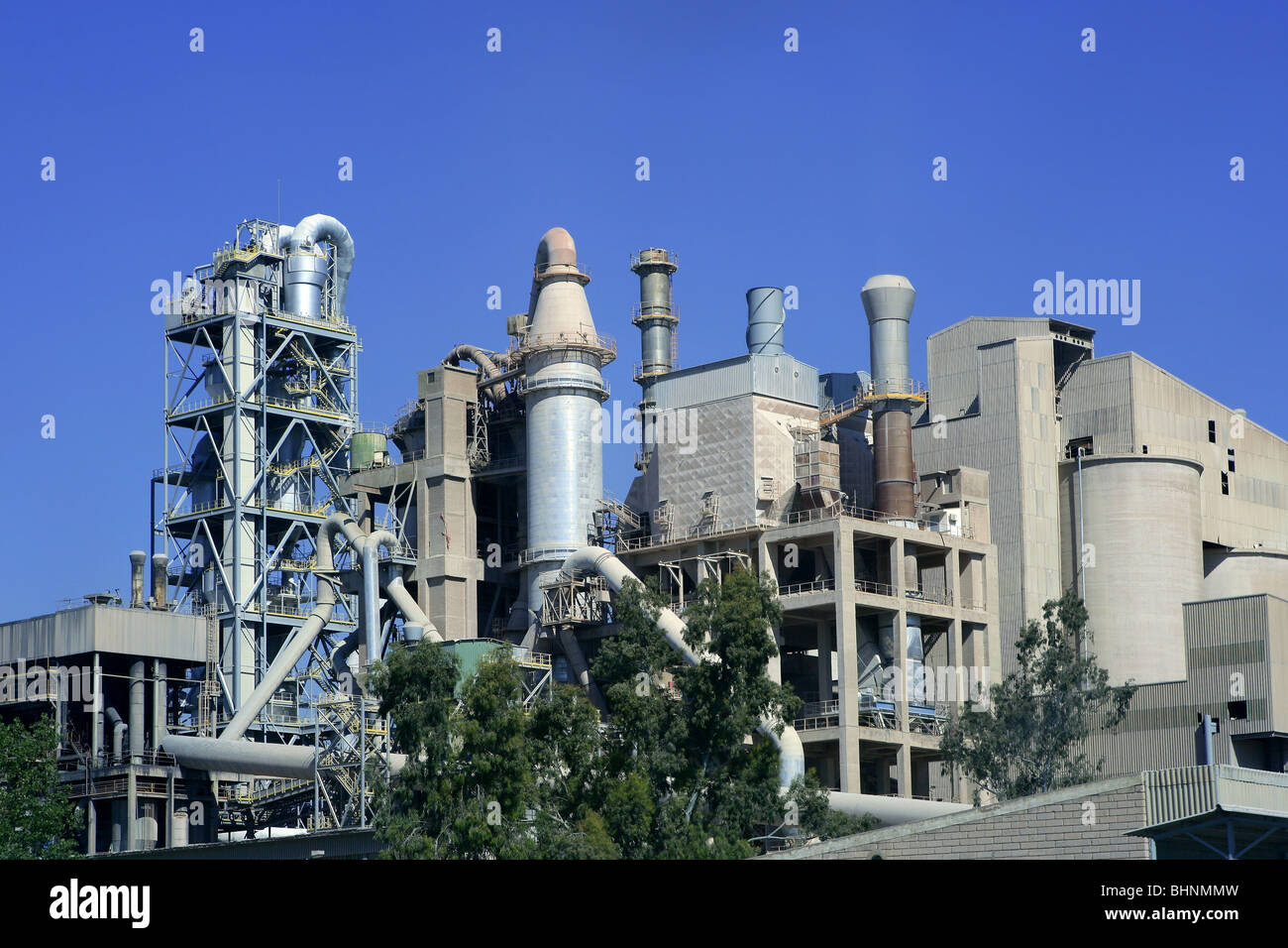 Cement factory view in a blue sunny day Stock Photo - Alamy