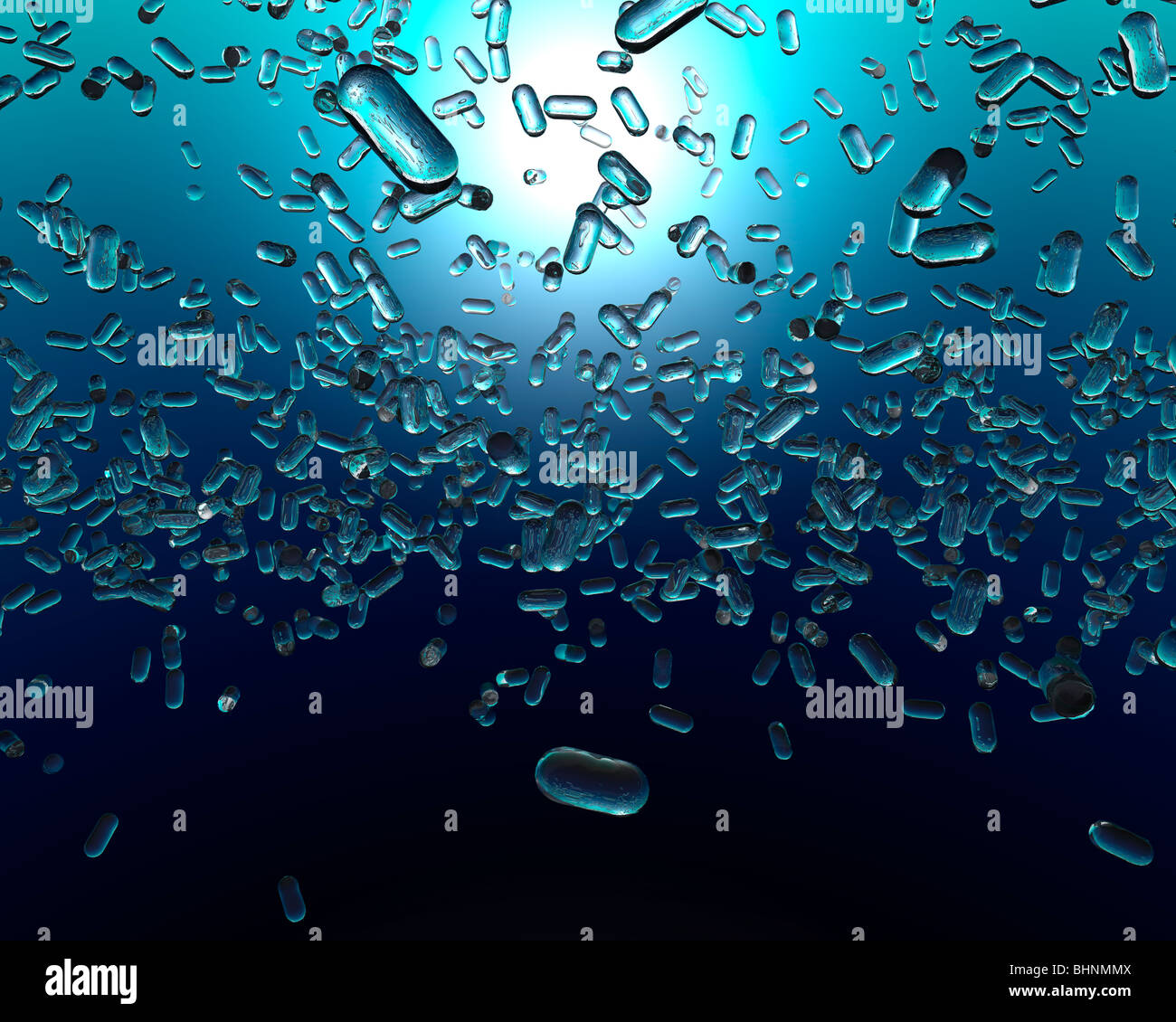 clear gel pills floating in water, blue background Stock Photo - Alamy