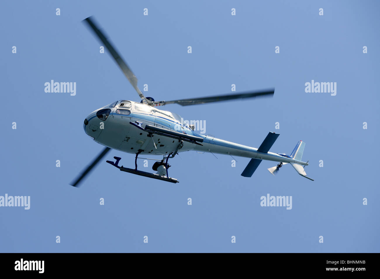Helicopter holding video camera filming Stock Photo - Alamy