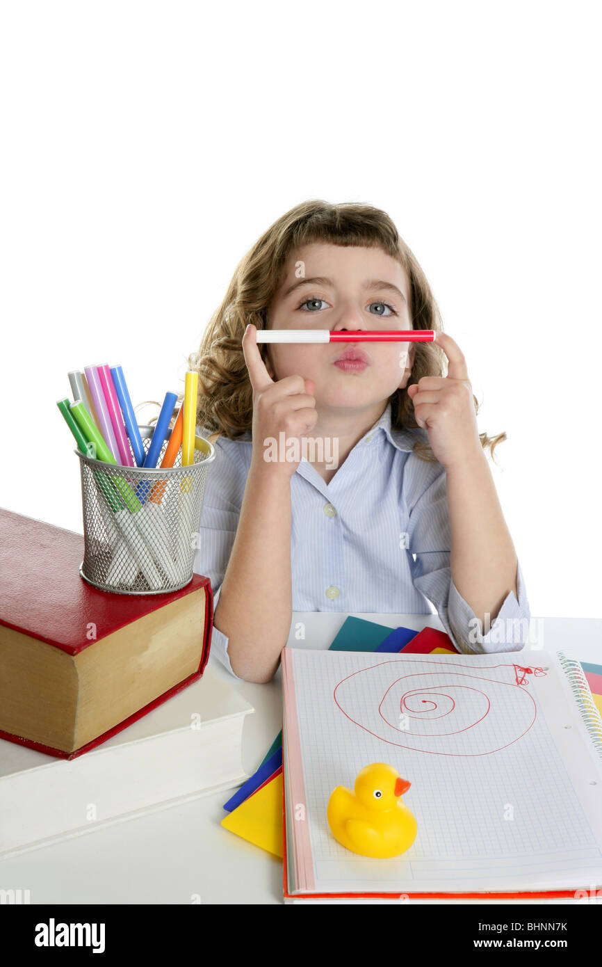 Brunette student little girl playing with marker on nouse at school ...