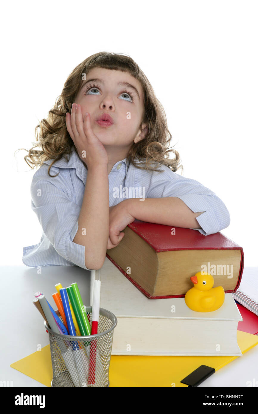 Bored student little girl isolated on white background Stock Photo - Alamy