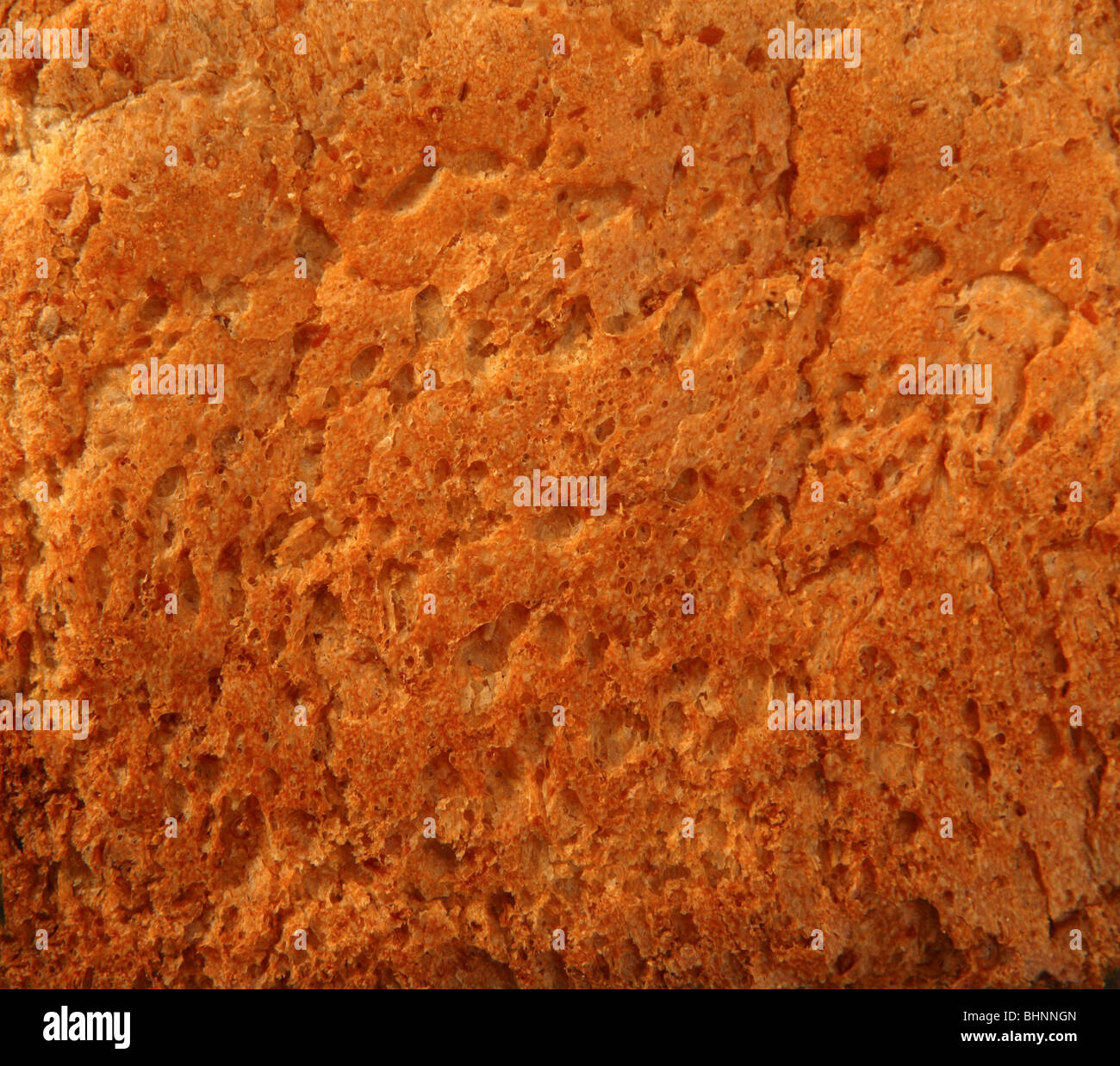 Bread golden warm crust bakery texture orange background Stock Photo ...