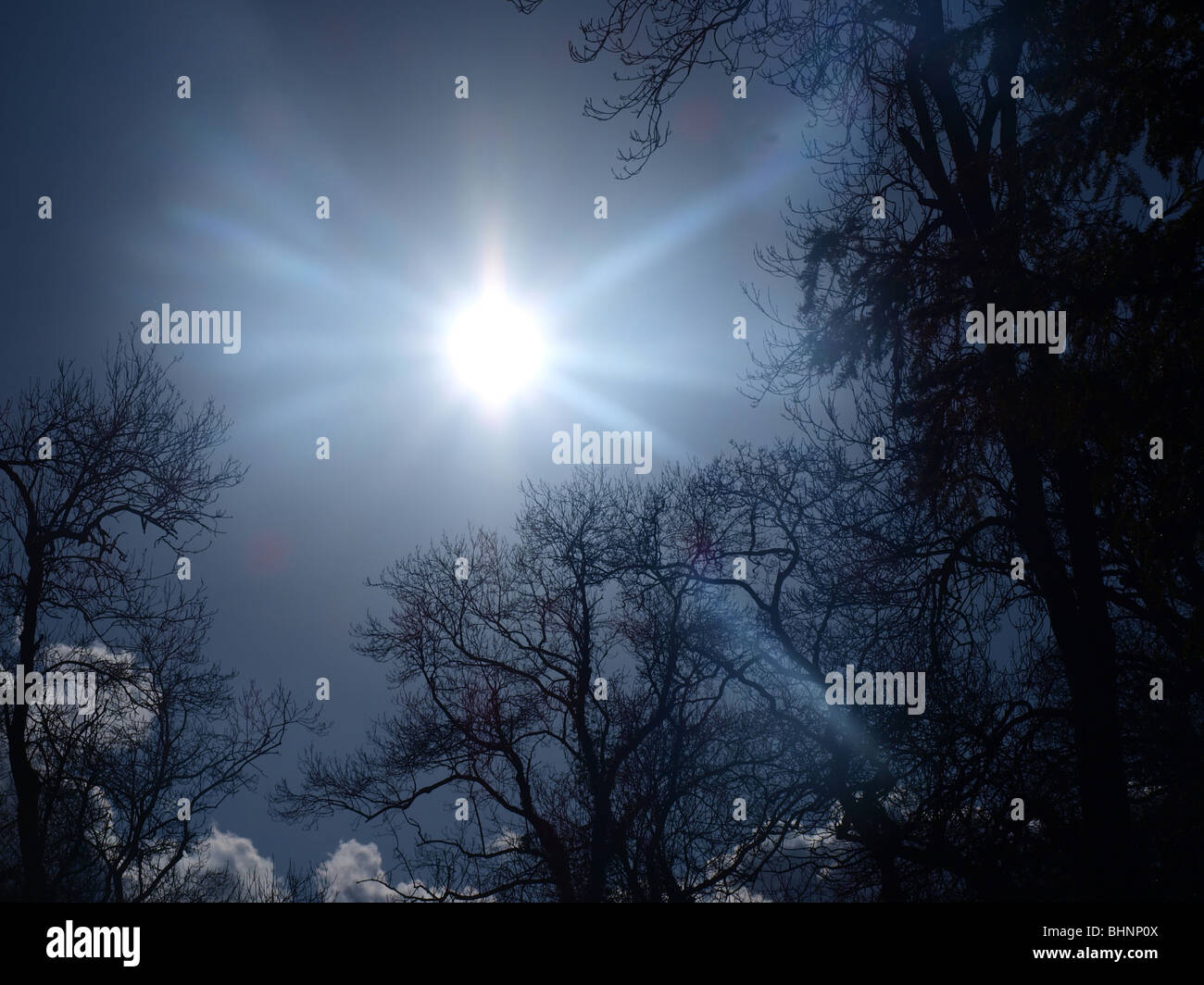 sun in dark blue sky Stock Photo - Alamy