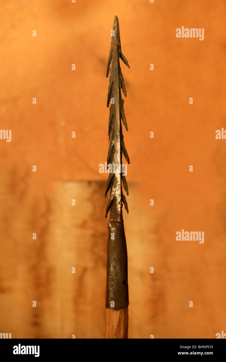 African lance weapon iron arrowhead in orange background Stock Photo ...