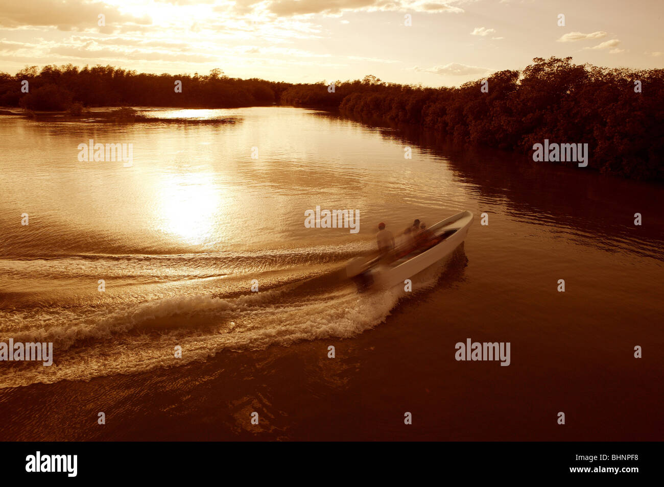 Boat ship wake prop wash curve on sunset lake river Stock Photo - Alamy