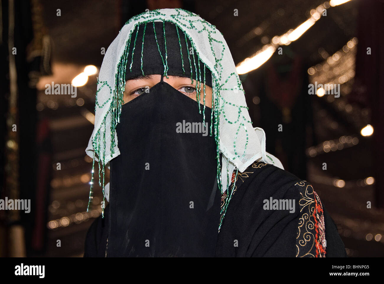Woman dress with traditional arabic clothes inside a jaima, Wadi Rum ...