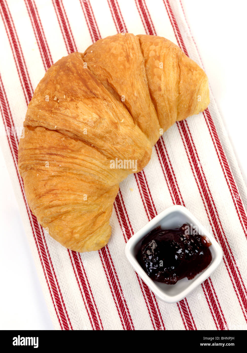 A croissant served with jam Stock Photo - Alamy