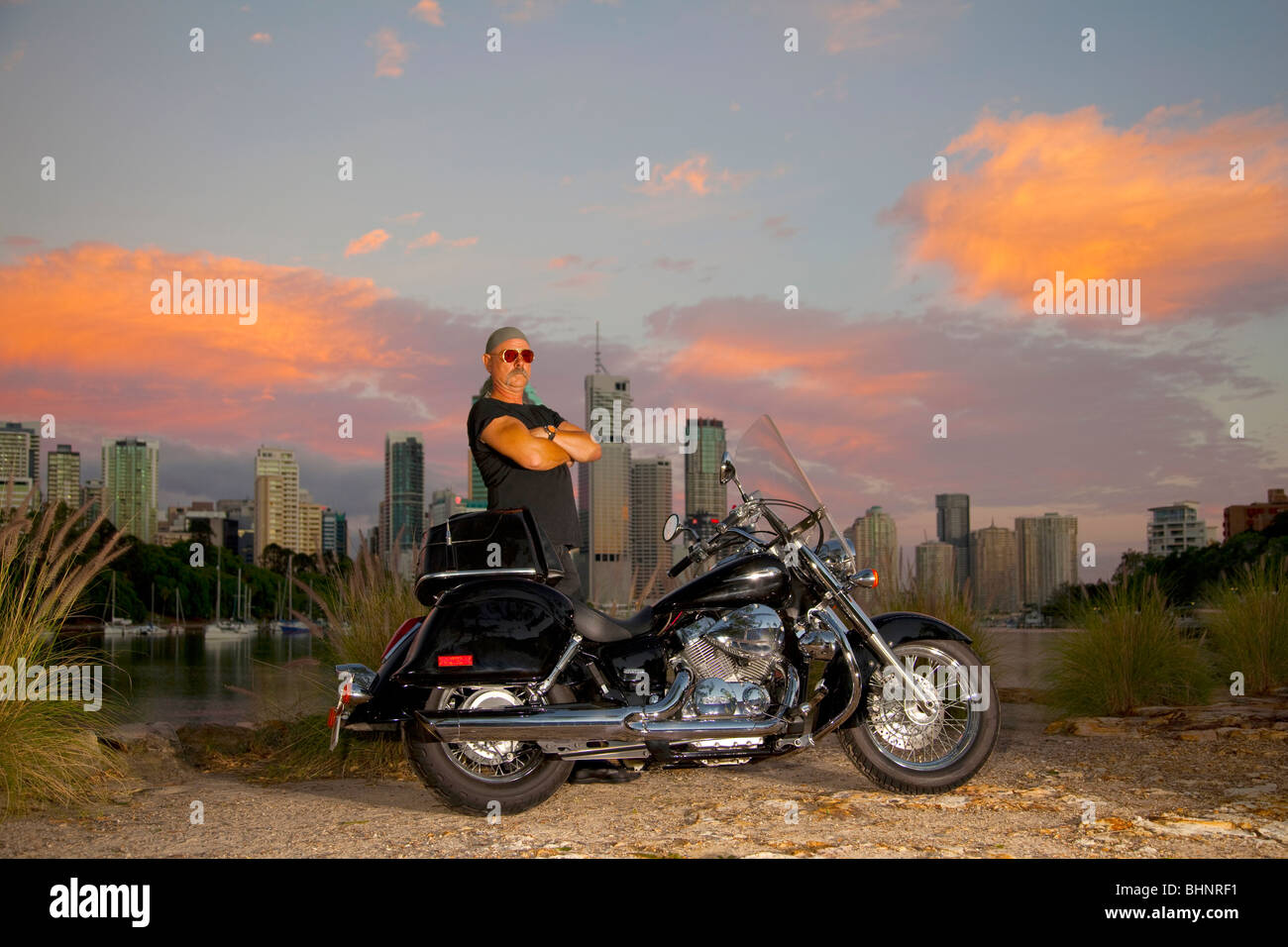 Bike rider with a city background Stock Photo - Alamy