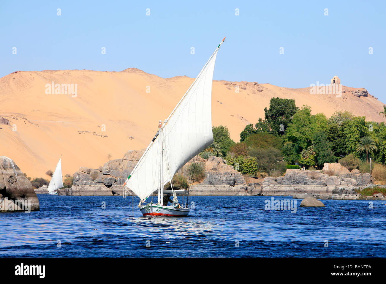 Two feluccas sailing around Elephantine Island in Aswan, Egypt Stock ...