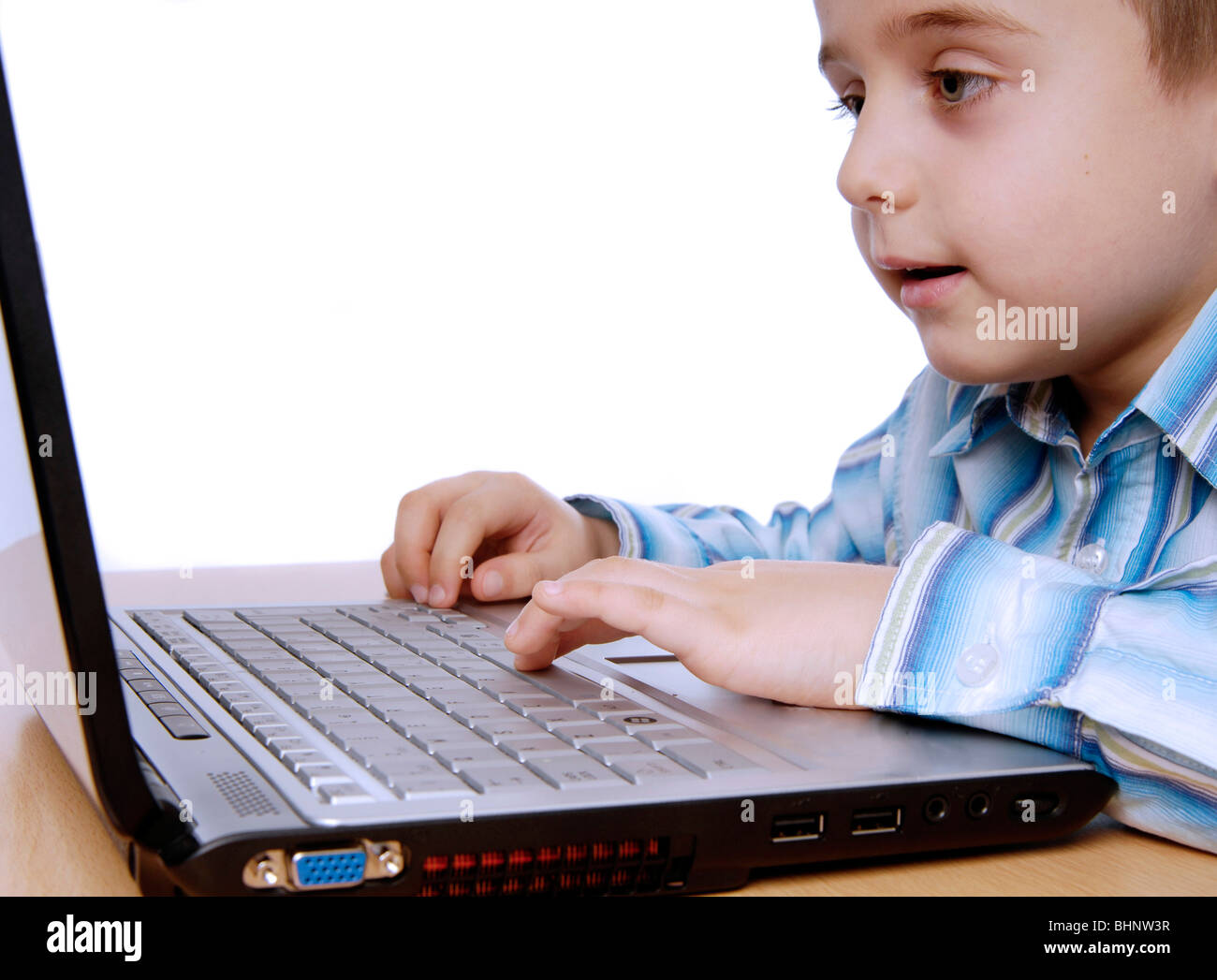 young boy using his laptop Stock Photo - Alamy