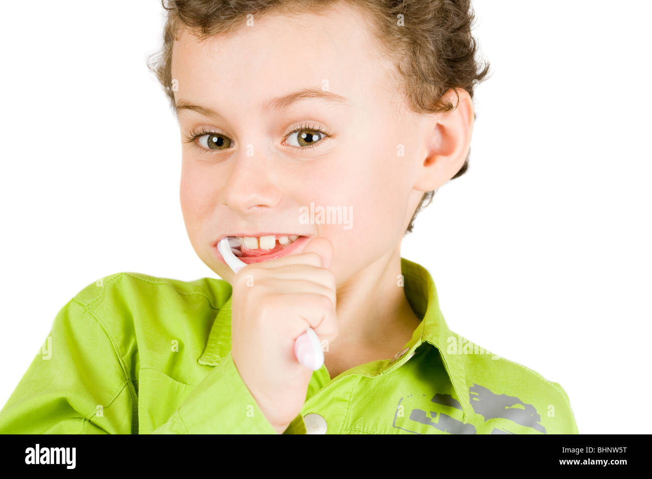 Beautiful boy brushing teeth, isolated on white Stock Photo - Alamy
