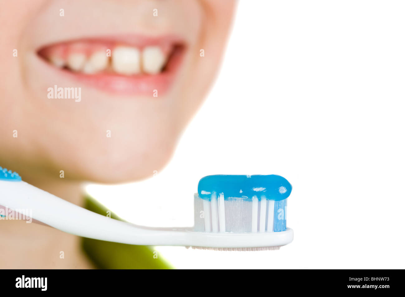 Beautiful boy brushing teeth, isolated on white Stock Photo - Alamy