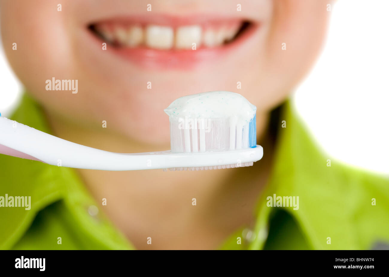 Beautiful boy brushing teeth, isolated on white Stock Photo - Alamy
