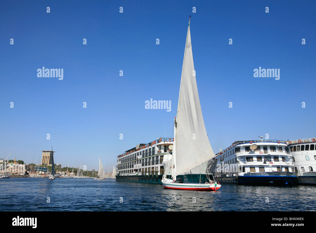New vs old - Felucca vs cruiseship in Aswan, Egypt Stock Photo - Alamy