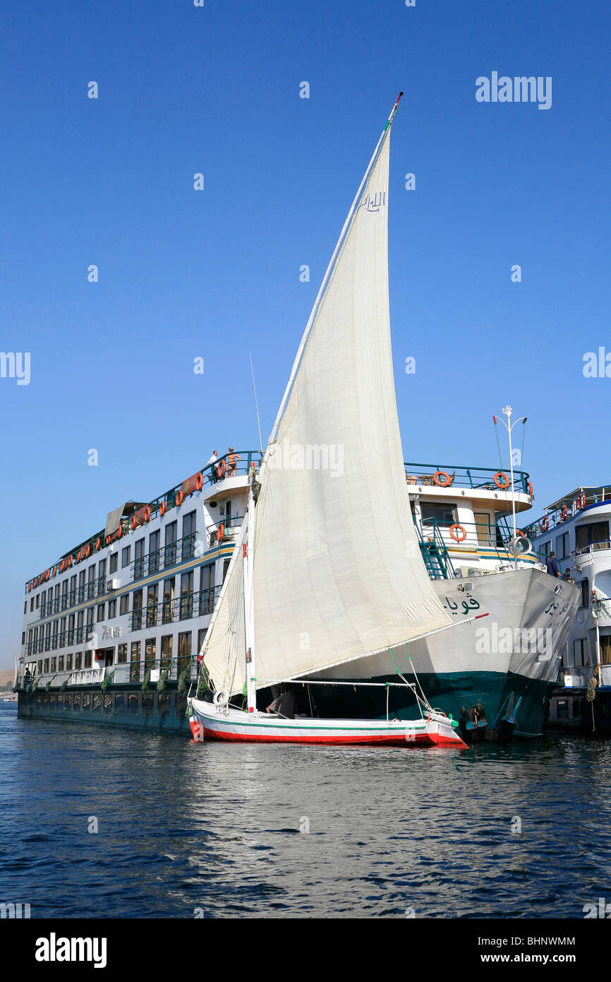 New vs old - Felucca vs cruiseship in Aswan, Egypt Stock Photo - Alamy