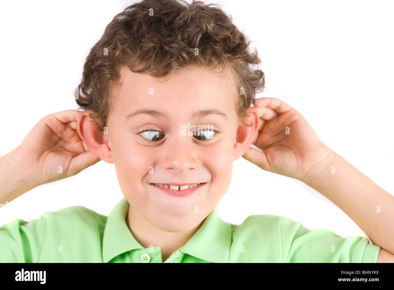 8 year old boy making silly faces Stock Photo - Alamy