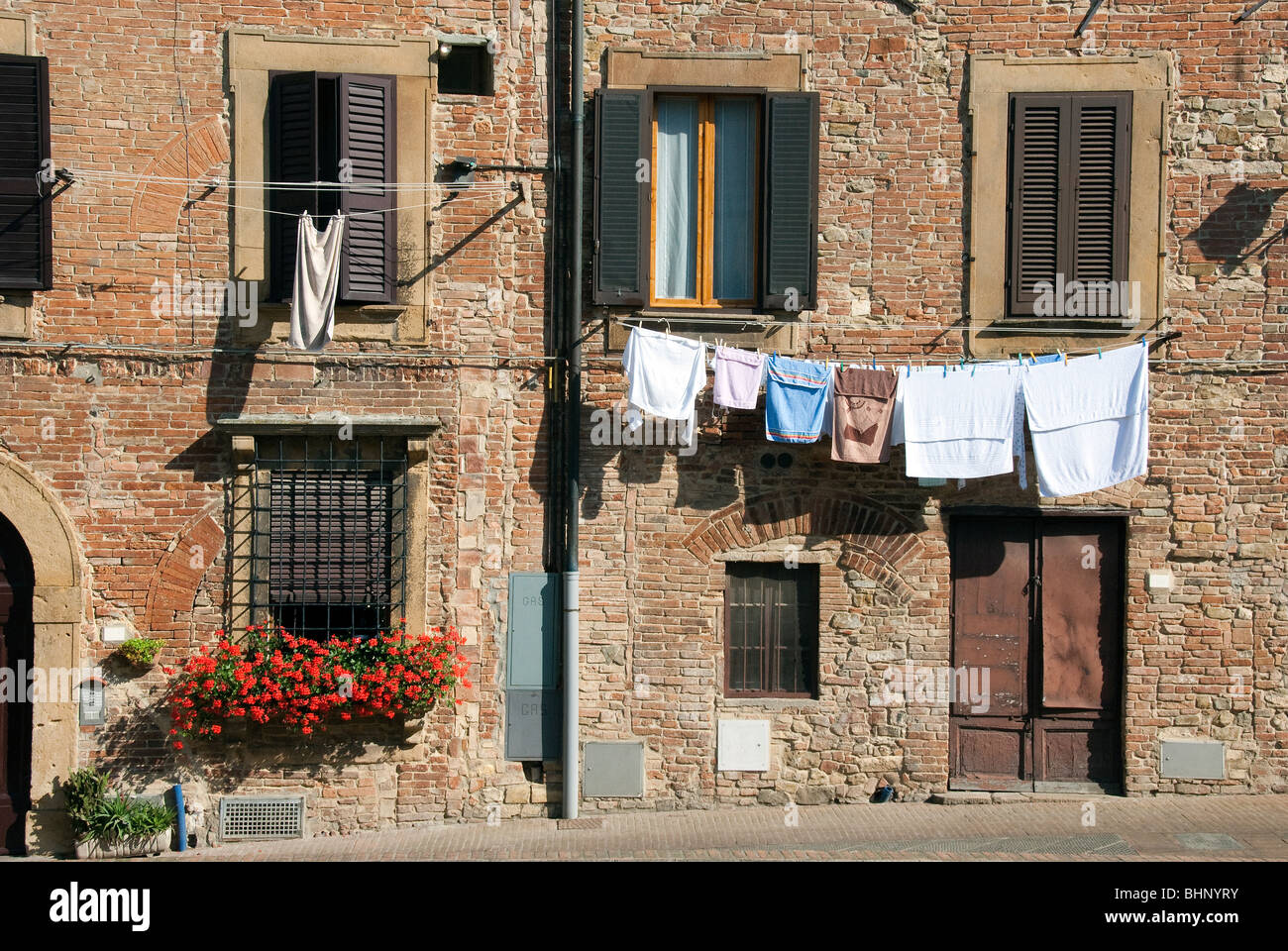 Line of washing from a window in Gambassi Terme, Tuscany Italy Stock ...